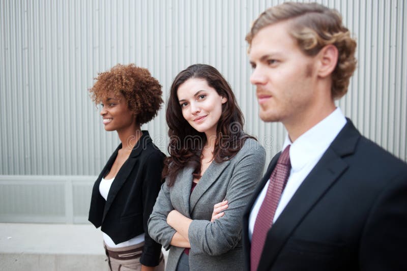 Attractive Young Business Group Standing Together at Office Stock Photo ...