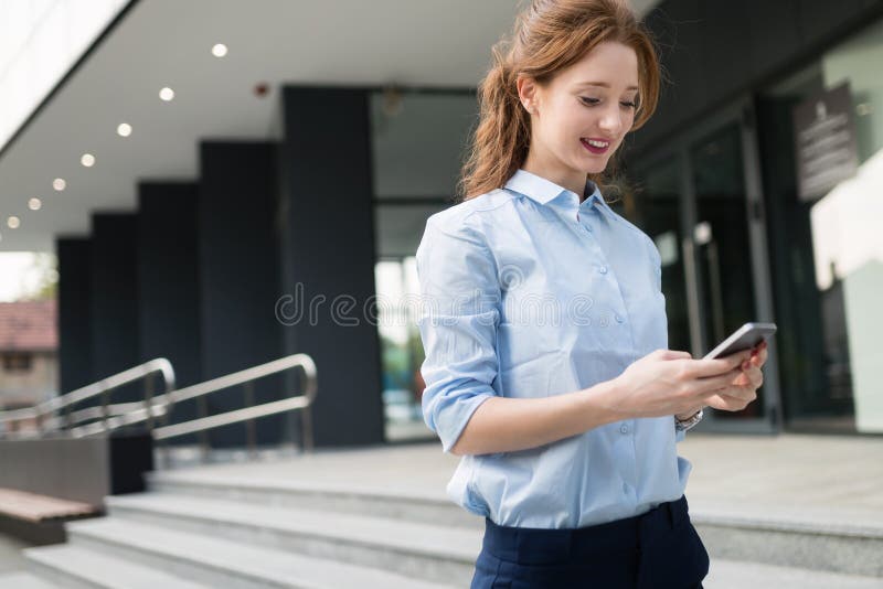 Attractive Young Businesswoman Using Mobile Phone Outside Stock Image ... Attractive Young Businesswoman Using Mobile Phone Outside Stock Image ...