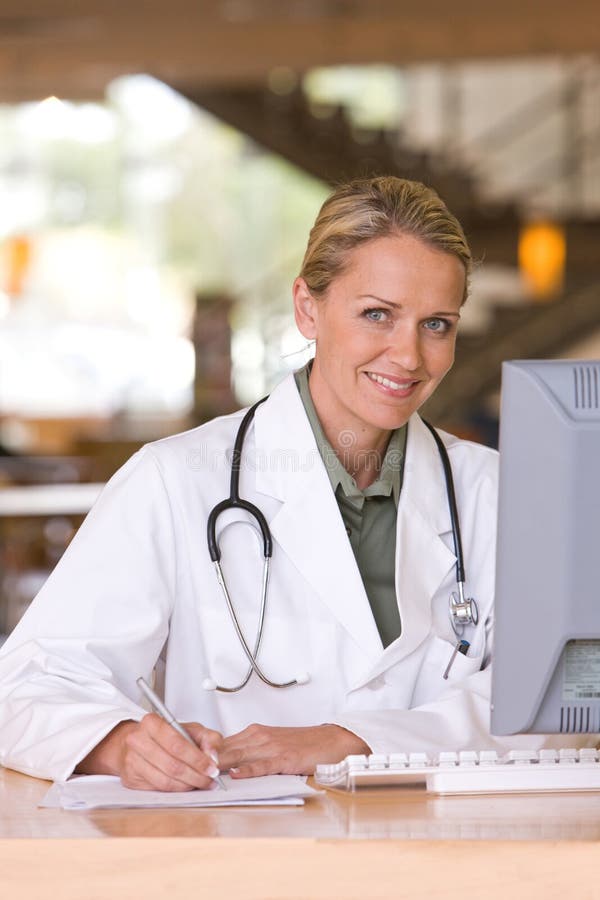 Attractive Young Caring Doctor Stock Photo - Image of pretty, adult ...