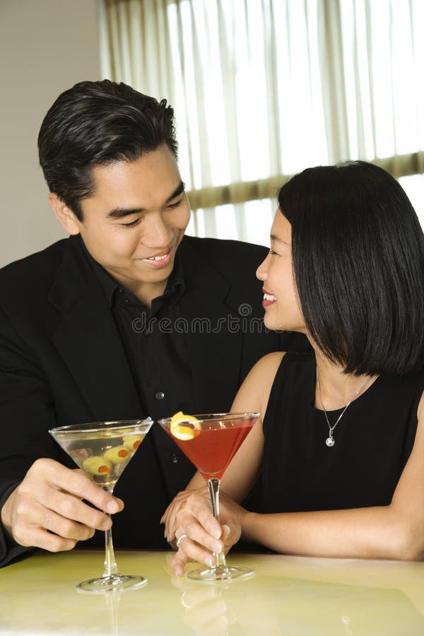 Attractive Young Couple with Cocktails Smiling Stock Image - Image of ...