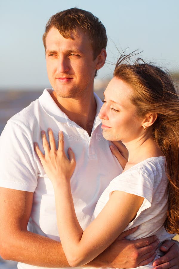 Attractive Young Couple Cuddling at the Beach. Close Up Stock Image ...