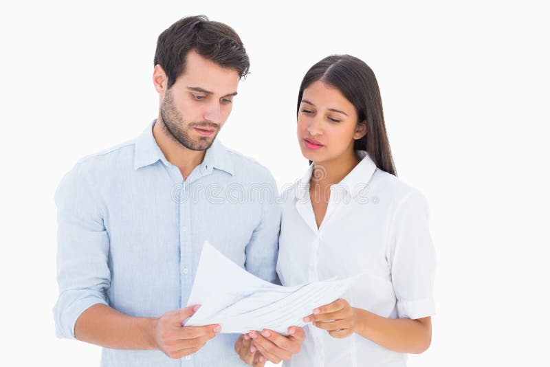 Attractive Young Couple Reading Their Bills Stock Photo - Image of ...