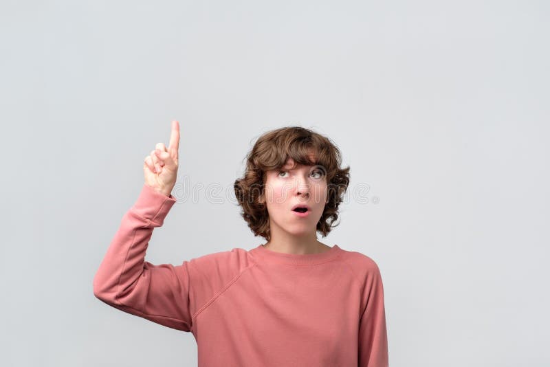 Young Curly Woman Pointing Up. Pay Attention Stock Image - Image of ...