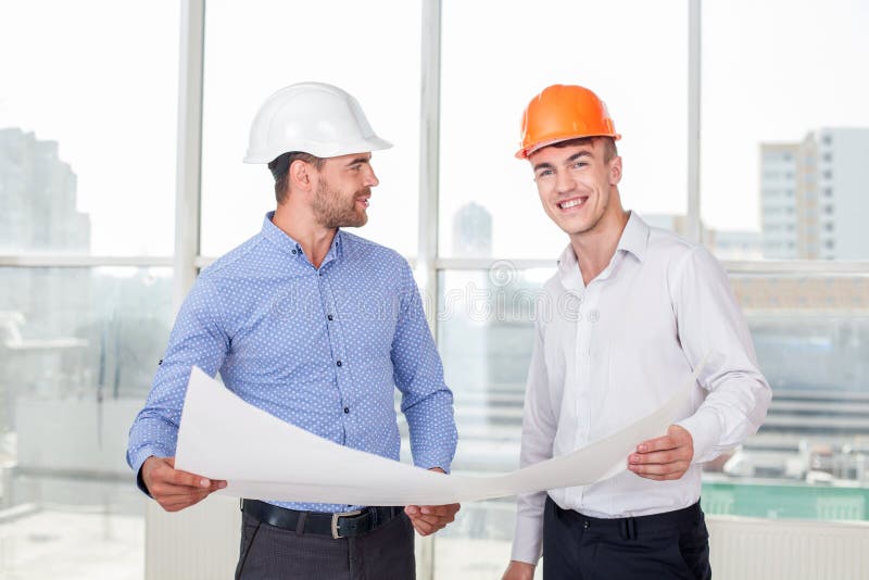 Attractive Young Engineer is Explaining the Plan Stock Photo - Image of ...