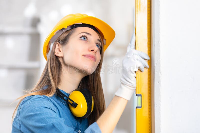Attractive Young Female Builder Checking Level Stock Photo - Image of ...