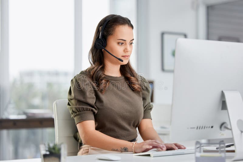 Focused on Finding a Solution. an Attractive Young Female Call Center ...