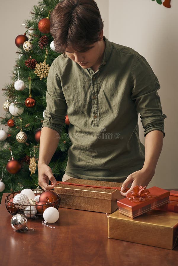 Attractive Young Guy at the Christmas Tree Stock Photo - Image of ...