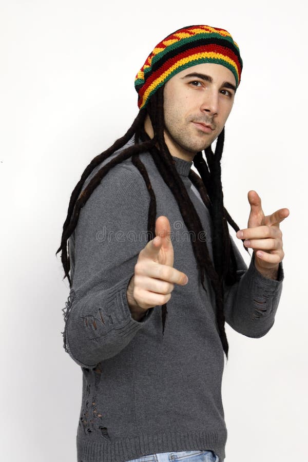 Attractive Young Guy with Very Long Dreadlocks and a Cap is Posing in ...