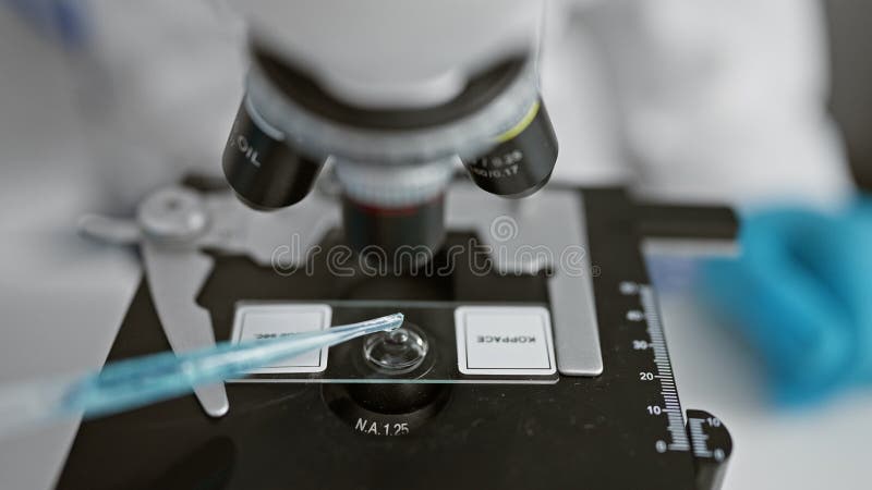 Attractive Young Hispanic Man, Grey-haired Scientist at Work, Pouring a ...
