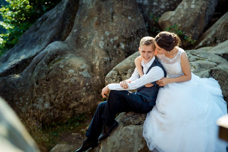 Attractive Young Just Married are Tenderly Hugging while Sitting on the ...