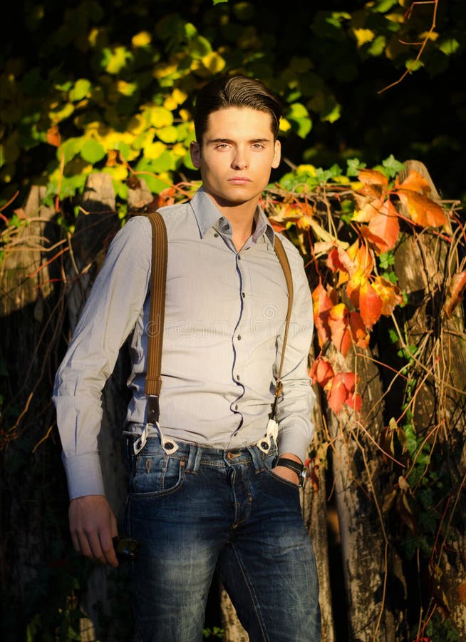 Portrait of Handsome Young Man in Autumn Park Stock Image - Image of ...