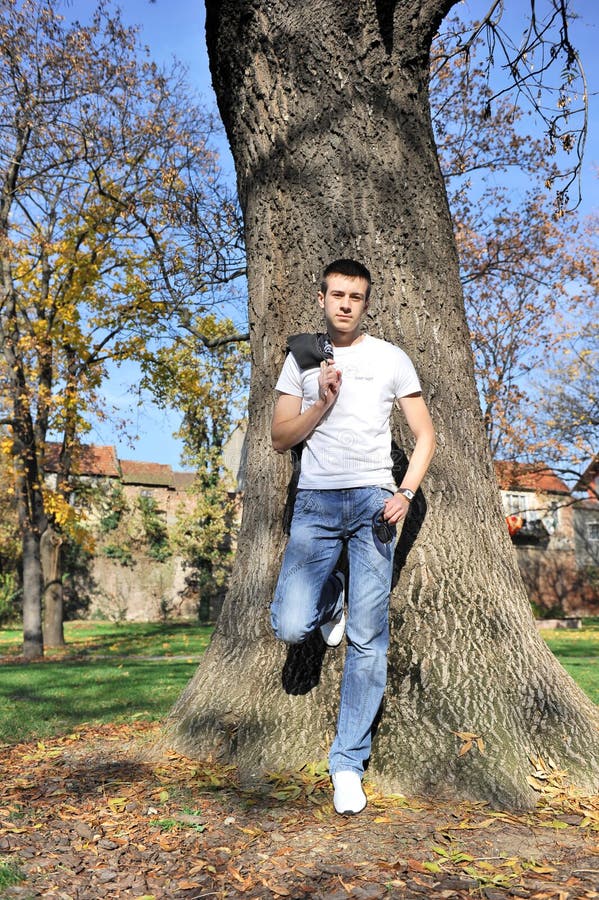 Man Behind the Tree stock photo. Image of environmental - 5594832