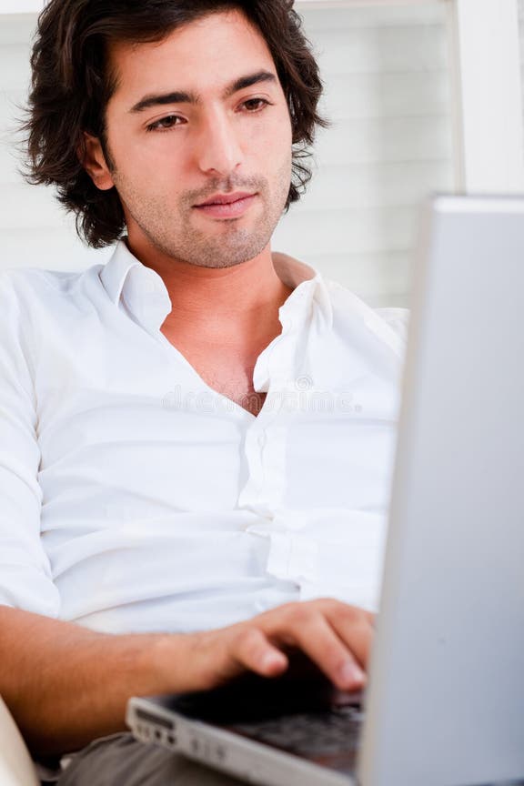 Attractive Young Man Browsing the Internet Stock Image - Image of ...