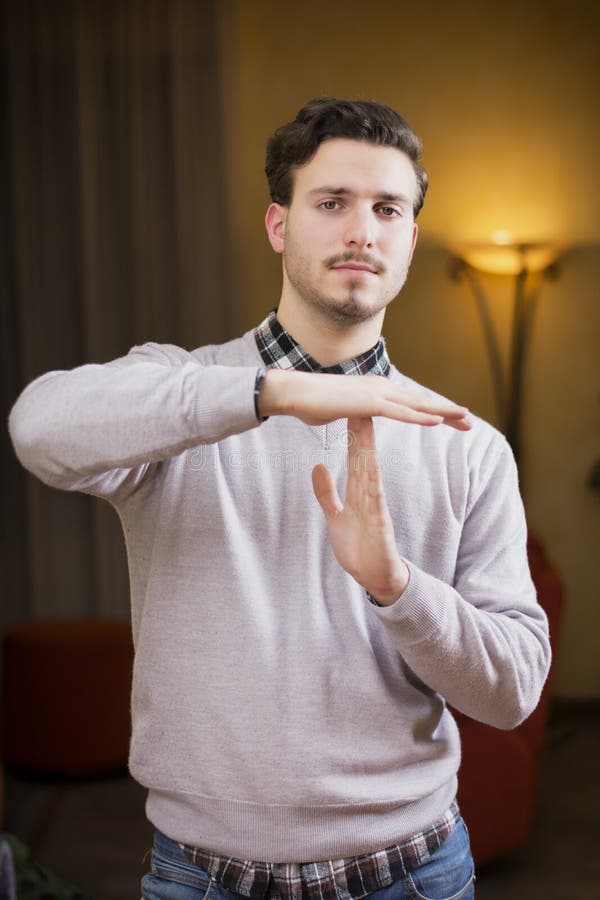Attractive Young Man Doing Time-out Sign Stock Image - Image of face ...