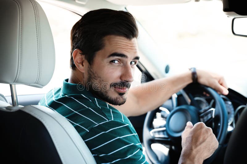 Attractive Man Driving Luxury Car, View from Backseat Stock Image ...
