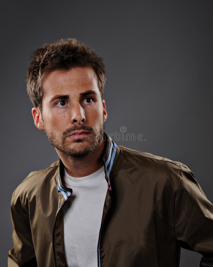 Attractive Young Man Looking Up To His Left. Stock Photo - Image of ...