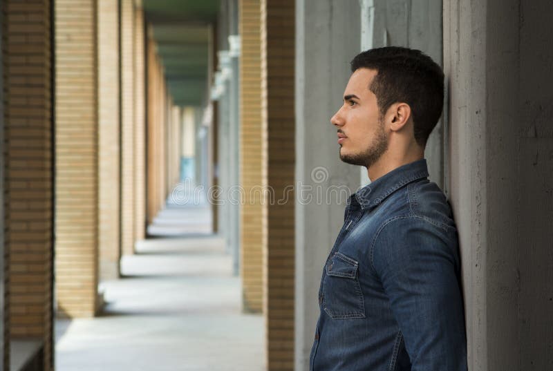 Attractive Young Man in Narrow Columns Corridor Outdoors Stock Image ...