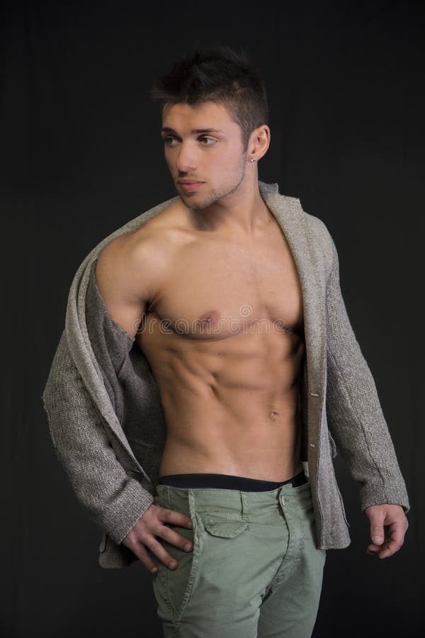 Confident, Attractive Young Man with Open Jacket on Muscular Torso ...