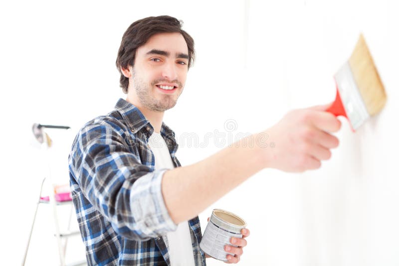 Attractive Young Man Painting a Wall in His New Flat Stock Photo ...