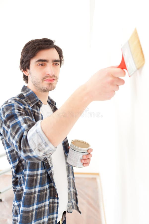 Attractive Young Man Painting a Wall in His New Flat Stock Photo ...