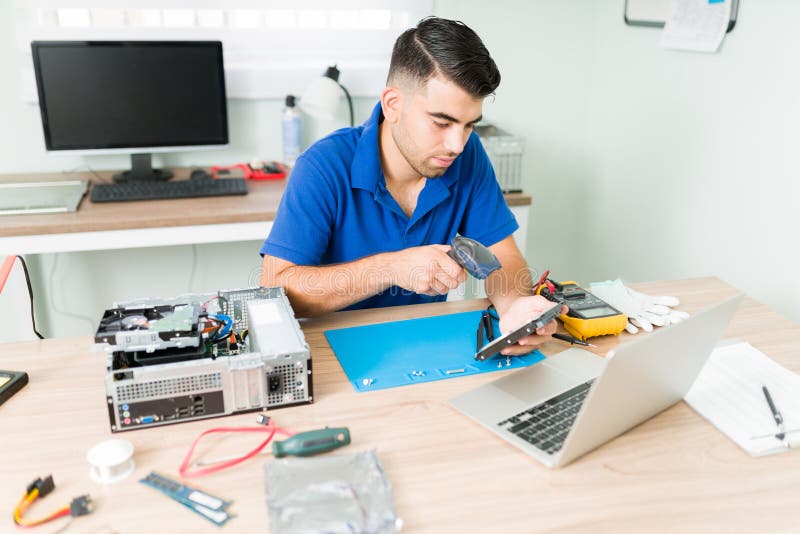 Attractive Young Man Searching for a Computer Piece Stock Image - Image ...