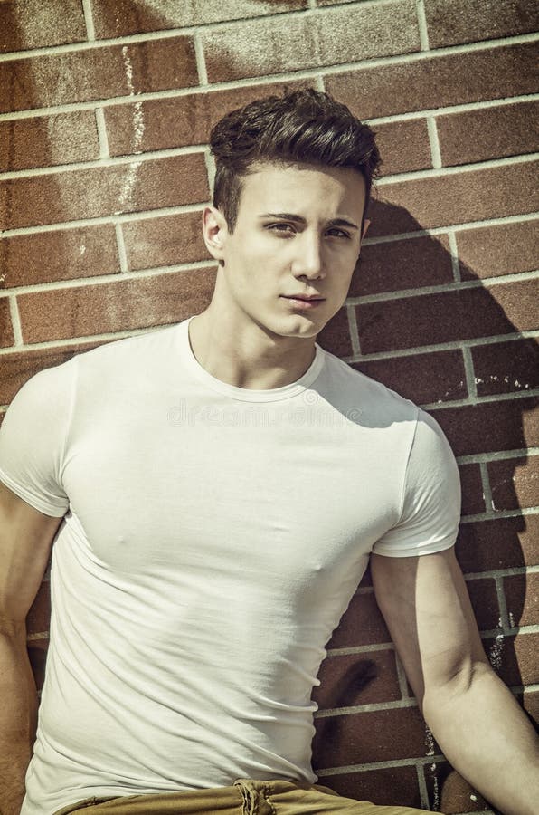 943 Attractive Young Man Standing Against Brick Wall Stock Photos ... 943 Attractive Young Man Standing Against Brick Wall Stock Photos ...