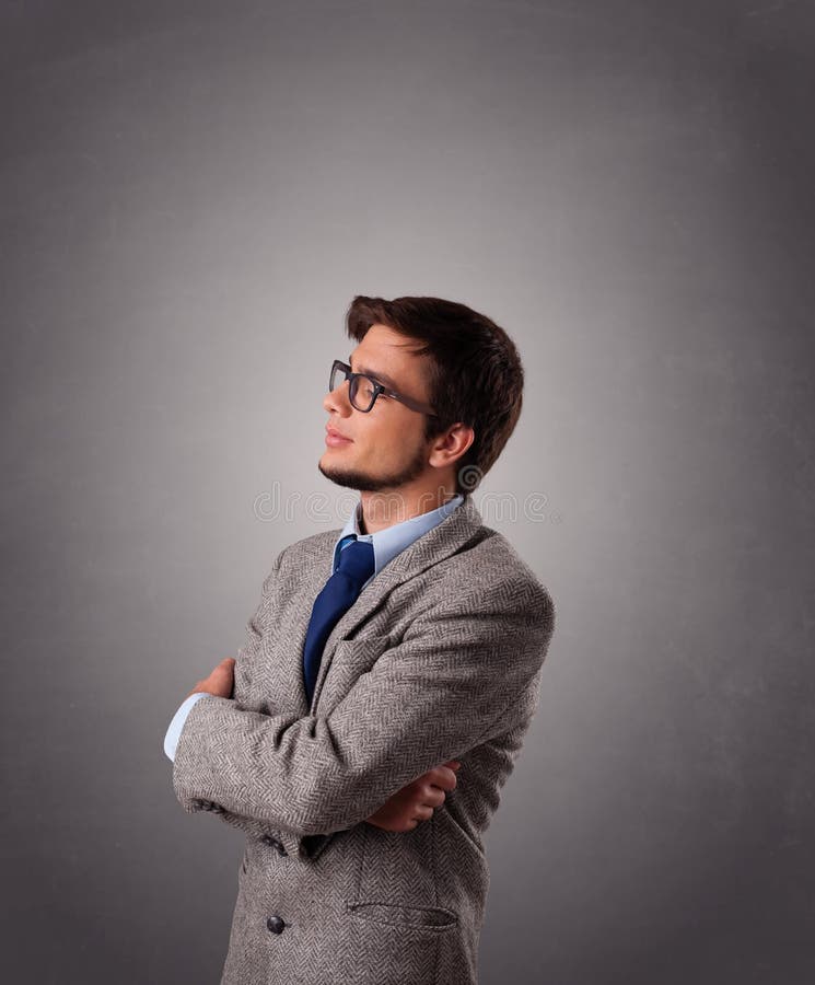 Attractive Young Man Standing and Thinking with Copy Space Stock Photo ...