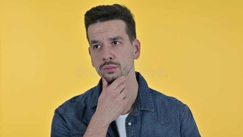 Attractive Young Man Thinking and Getting Idea, Yellow Background Stock ...