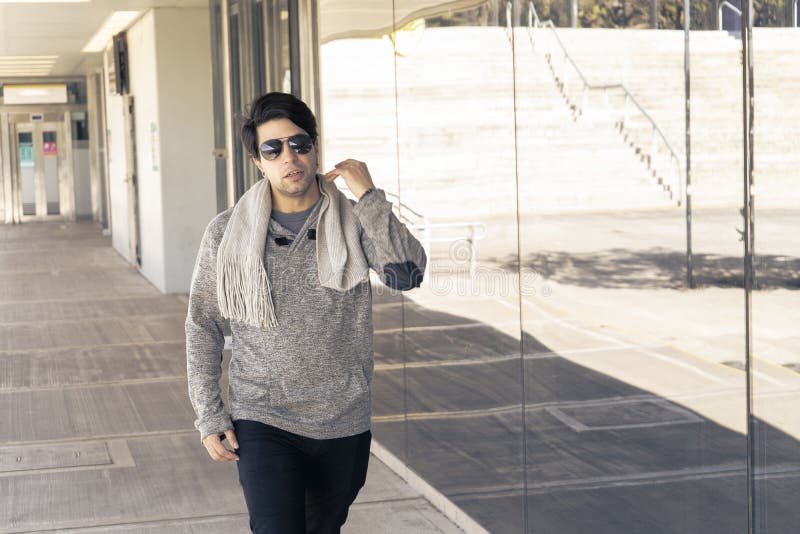 Attractive Young Man Walking Outside of a Building Stock Image - Image ...