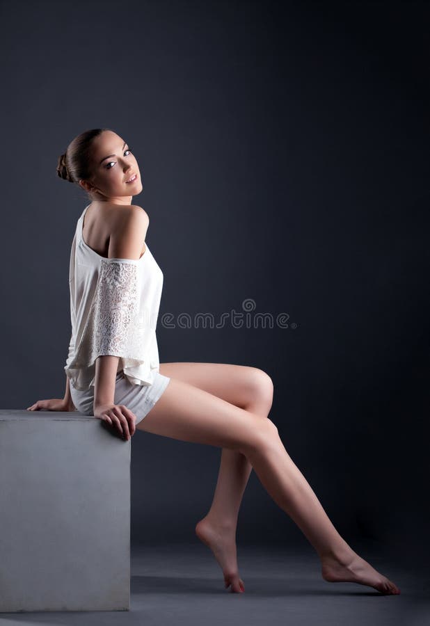 Attractive Young Model Posing Sitting on Cube Stock Image - Image of ...