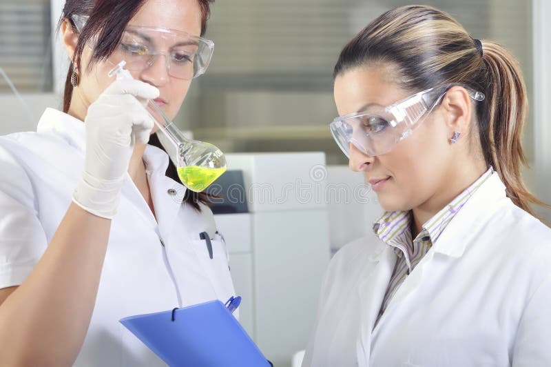 Attractive Young PhD Students Scientists Observing the Color Shift ...