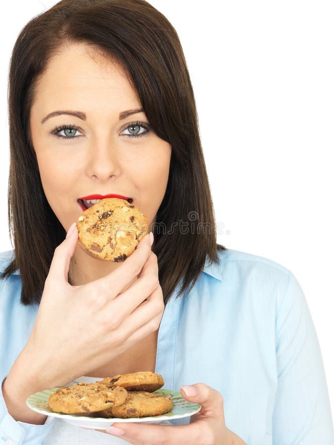 Attractive Young Woman Eating Biscuits Stock Photo - Image of dessert ...