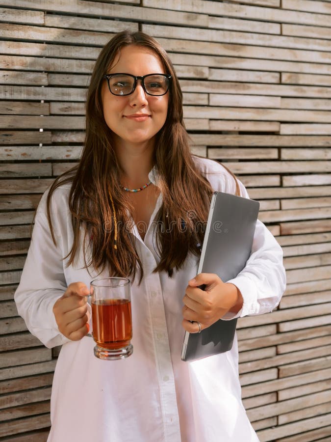 Attractive Young Woman with Laptop Computer and Cup of Tea Stock Image ...