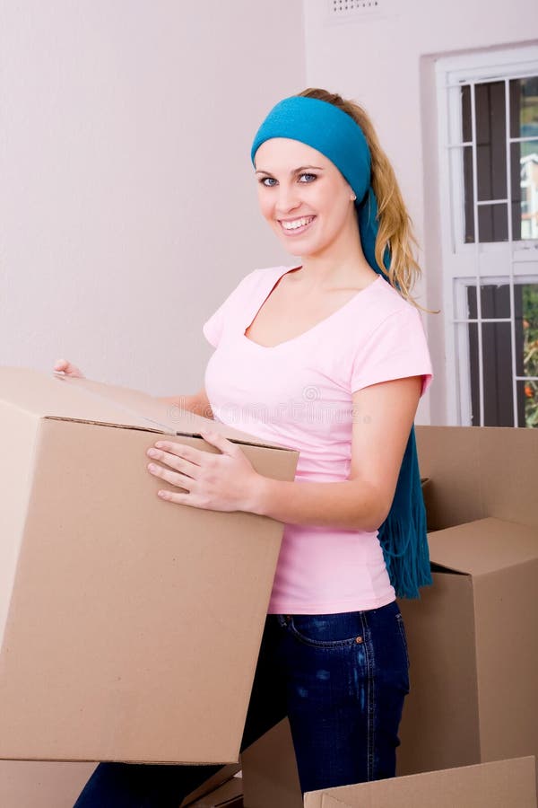 Woman Moving into New Home Hanging Picture Stock Image - Image of ...