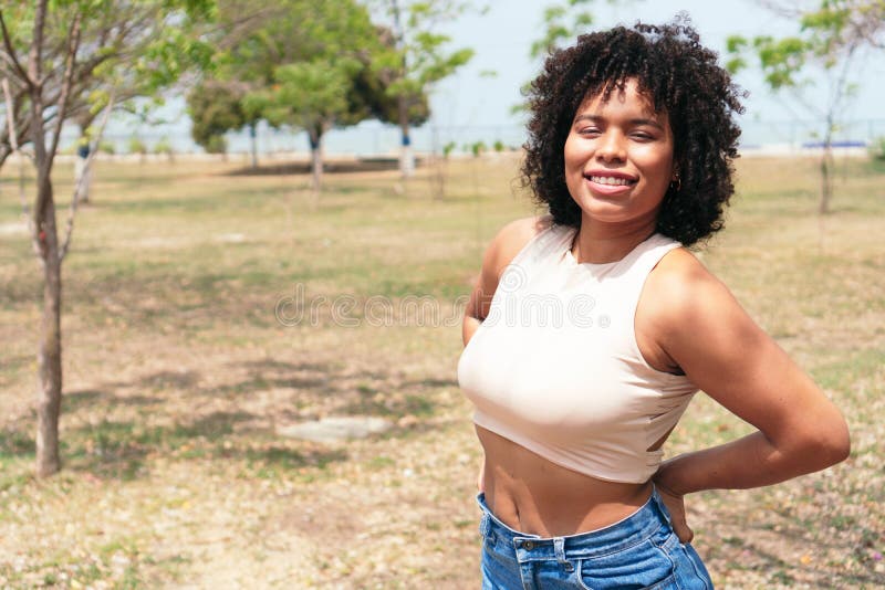 Attractive Young Woman in the Park Looking at Camera Stock Image ...