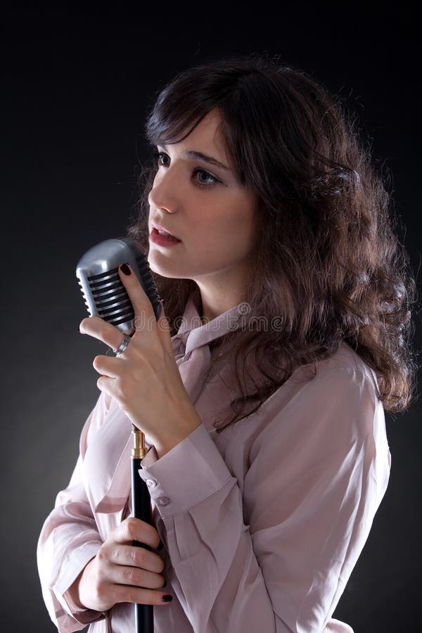 Attractive Young Woman with a Retro Microphone Stock Image - Image of ...