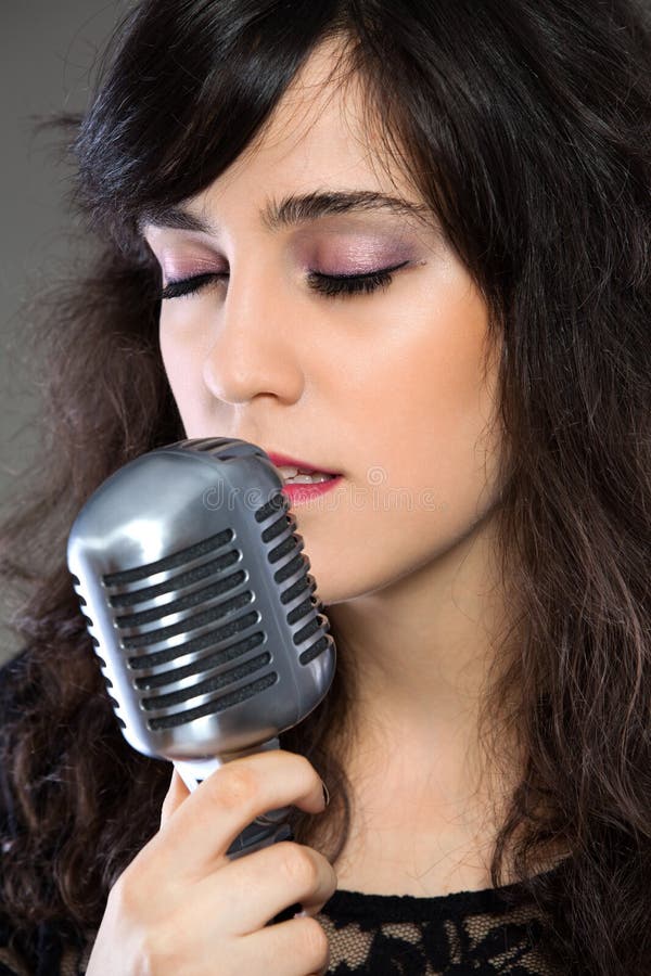 Attractive Young Woman with a Retro Microphone Stock Photo - Image of ...