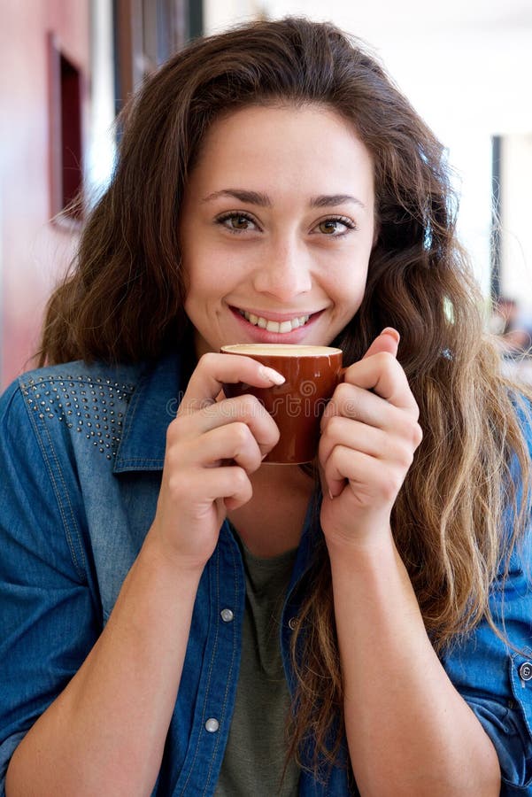 Attractive Young Woman Smiling with Cup of Coffee Stock Photo - Image ...