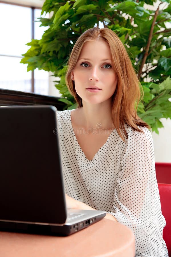 An Attractive Young Woman Using Her Laptop Stock Image - Image of cafe ...
