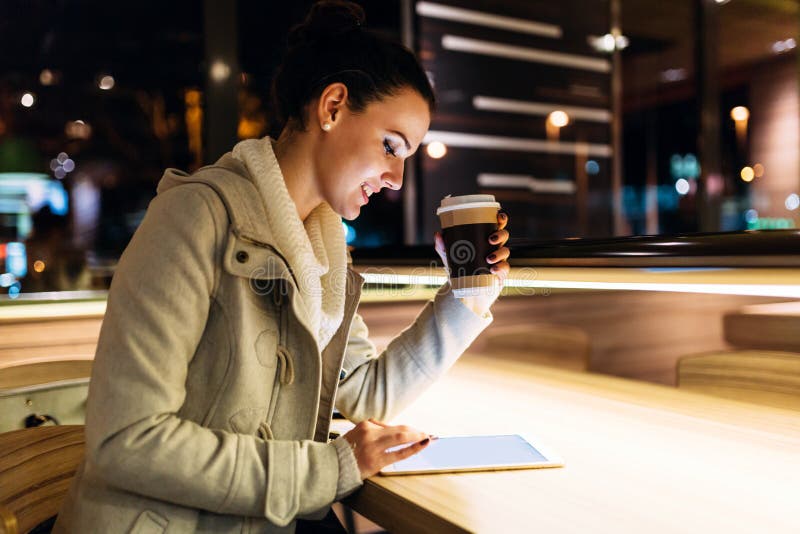 Attractive Young Woman Using Tablet in Cafe Stock Photo - Image of ... Attractive Young Woman Using Tablet in Cafe Stock Photo - Image of ...
