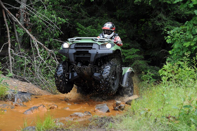 ATV in creek stock photo. Image of skill, motorcycle - 20110836