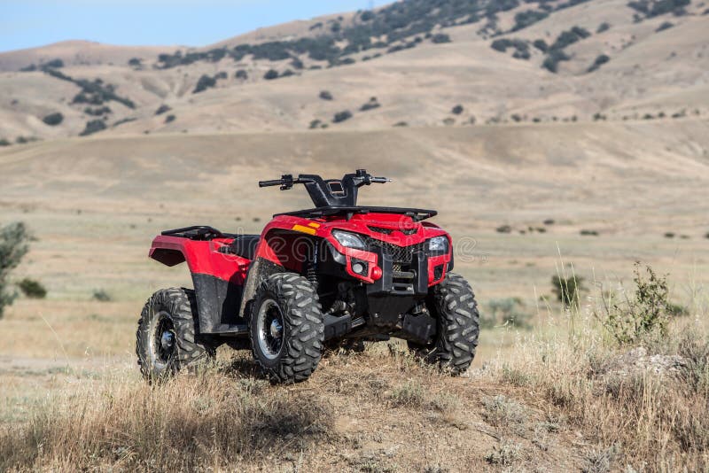 ATV on a Hill in the Highlands Stock Photo - Image of four, landscape ...