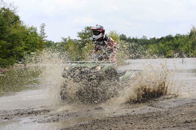 ATV in mudhole stock photo. Image of excitement, quad - 20110894
