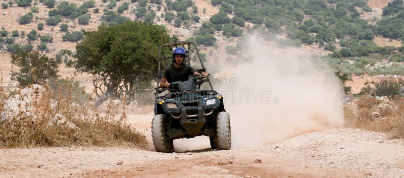 ATV quad runner stock image. Image of helmet, rocks, leisure - 10524175