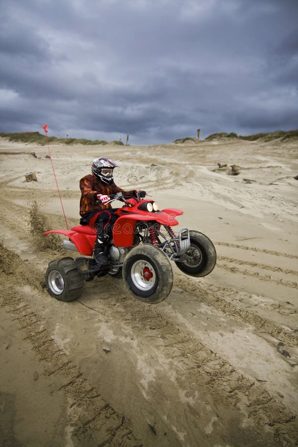 ATV Rider Pulling a Wheelie Stock Photo - Image of motorized, lens ...