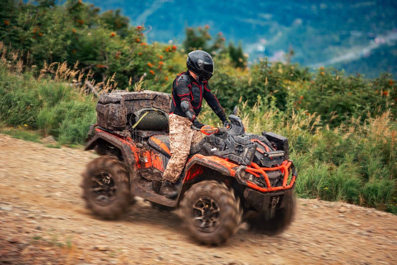 ATV Rider Rides through Forest Off-road in Summer Stock Photo - Image ...