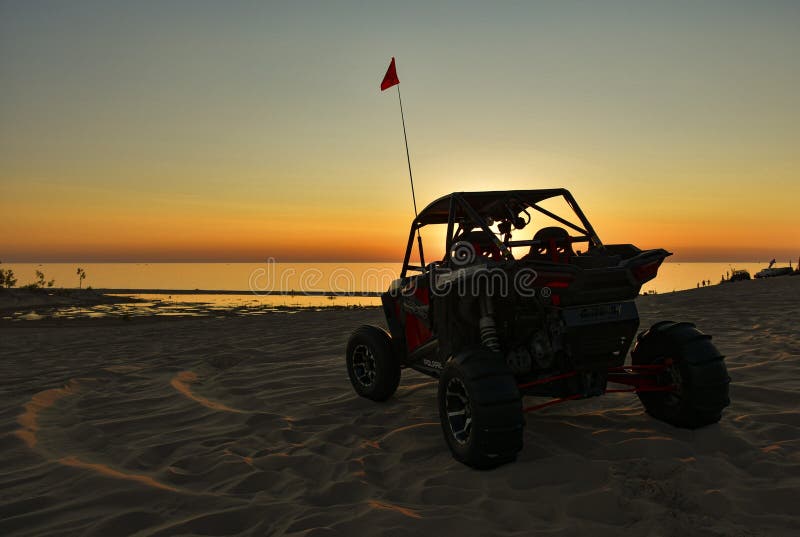 ATV in sunset on beach stock image. Image of summer - 192836837