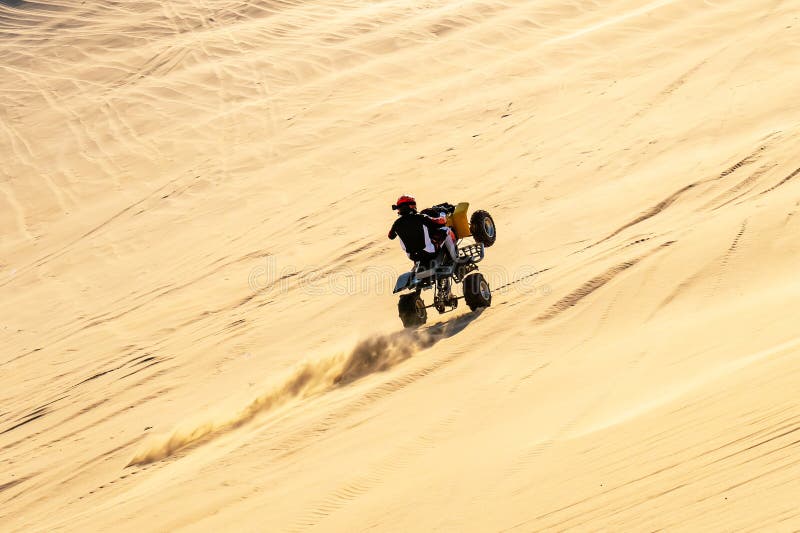 ATV is Traveling through the Desert at High Speed. Stock Image - Image ...