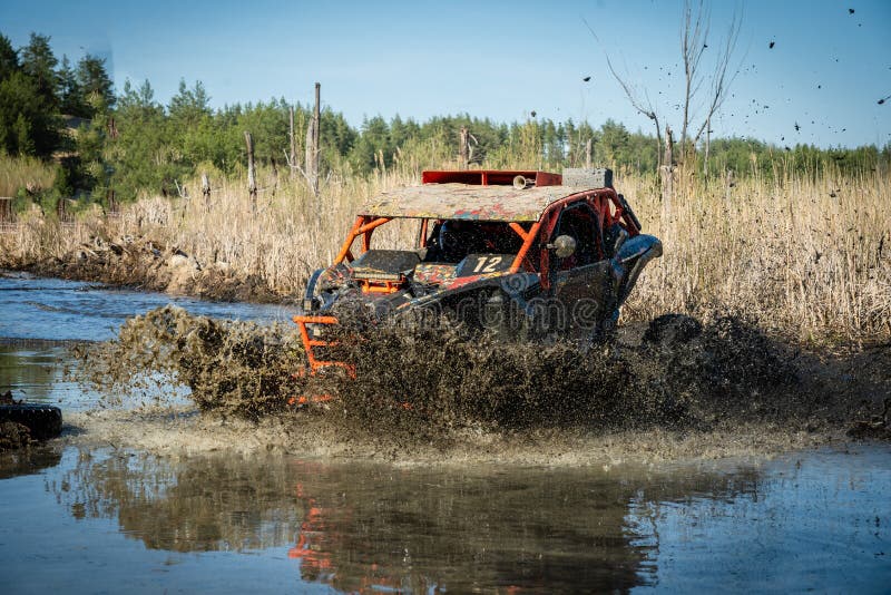 ATV and UTV Riding in Hard Track with Huge Mud Splash. Amateur ...