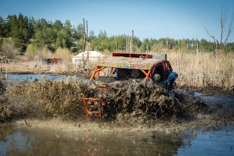 ATV and UTV Riding in Hard Track with Huge Mud Splash. Amateur ...